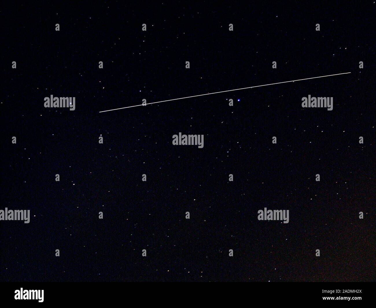 ISS light trail, time-exposure image. This streak of light was formed ...