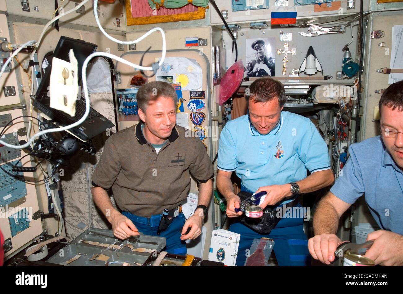 Astronauts eating a meal on the International Space Station (ISS ...