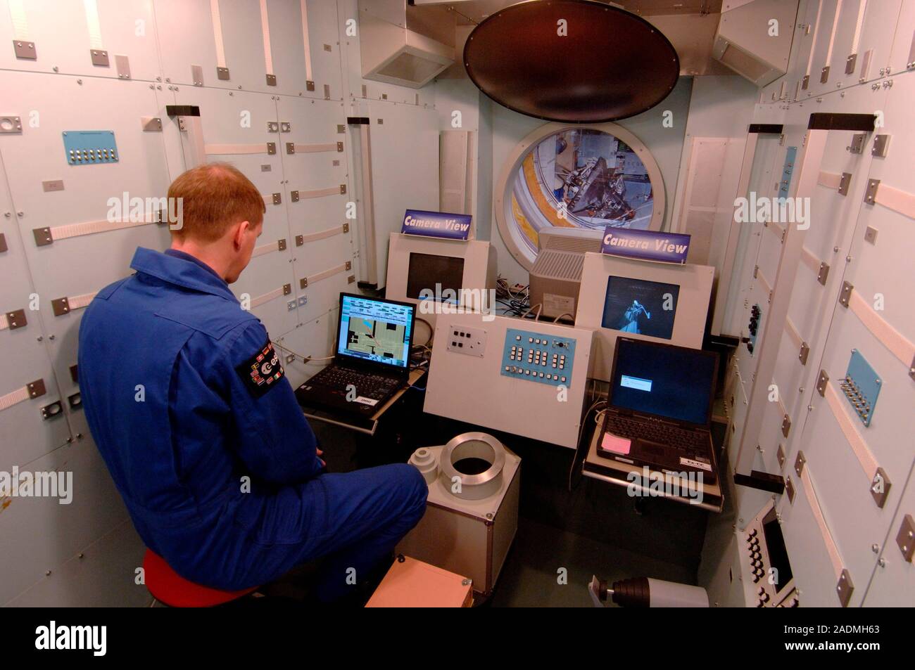 European robotic arm simulation. Engineer taking part in a simulation ...