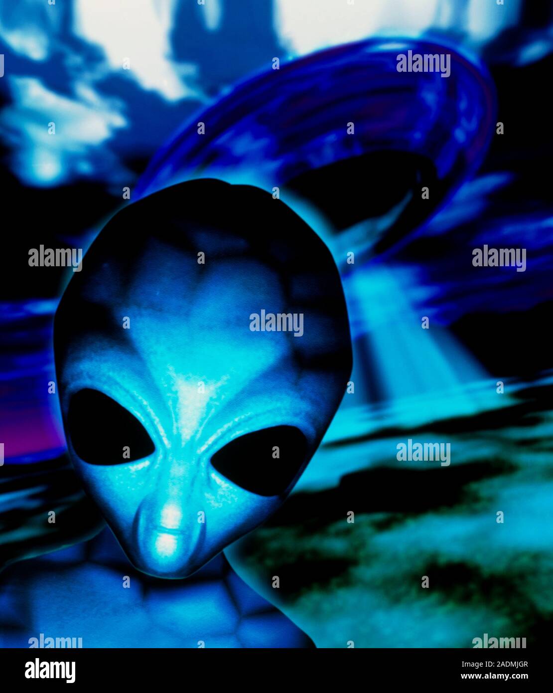 Space alien and UFO. Computer artwork of an alien or extraterrestrial ...