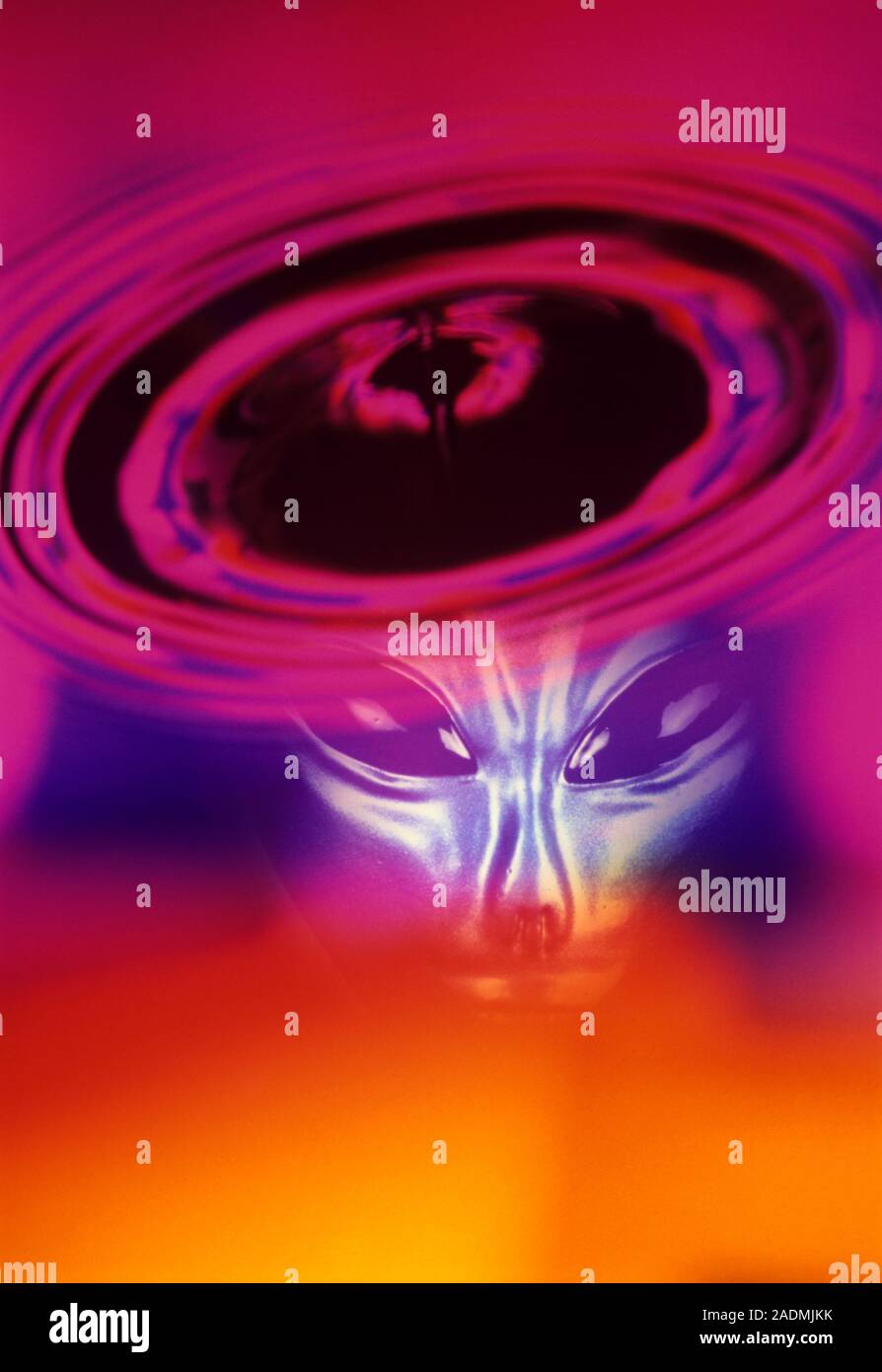 Alien. Composite image of an alien's face and a water droplet impact ...