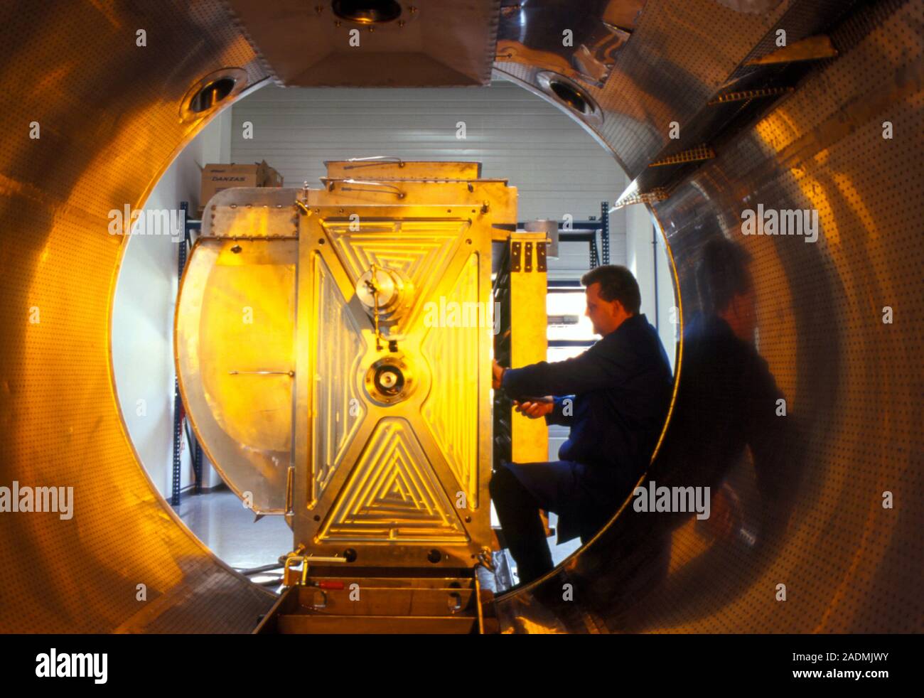 Hot module fuel cell. Technician assembling a hot module fuel cell ...