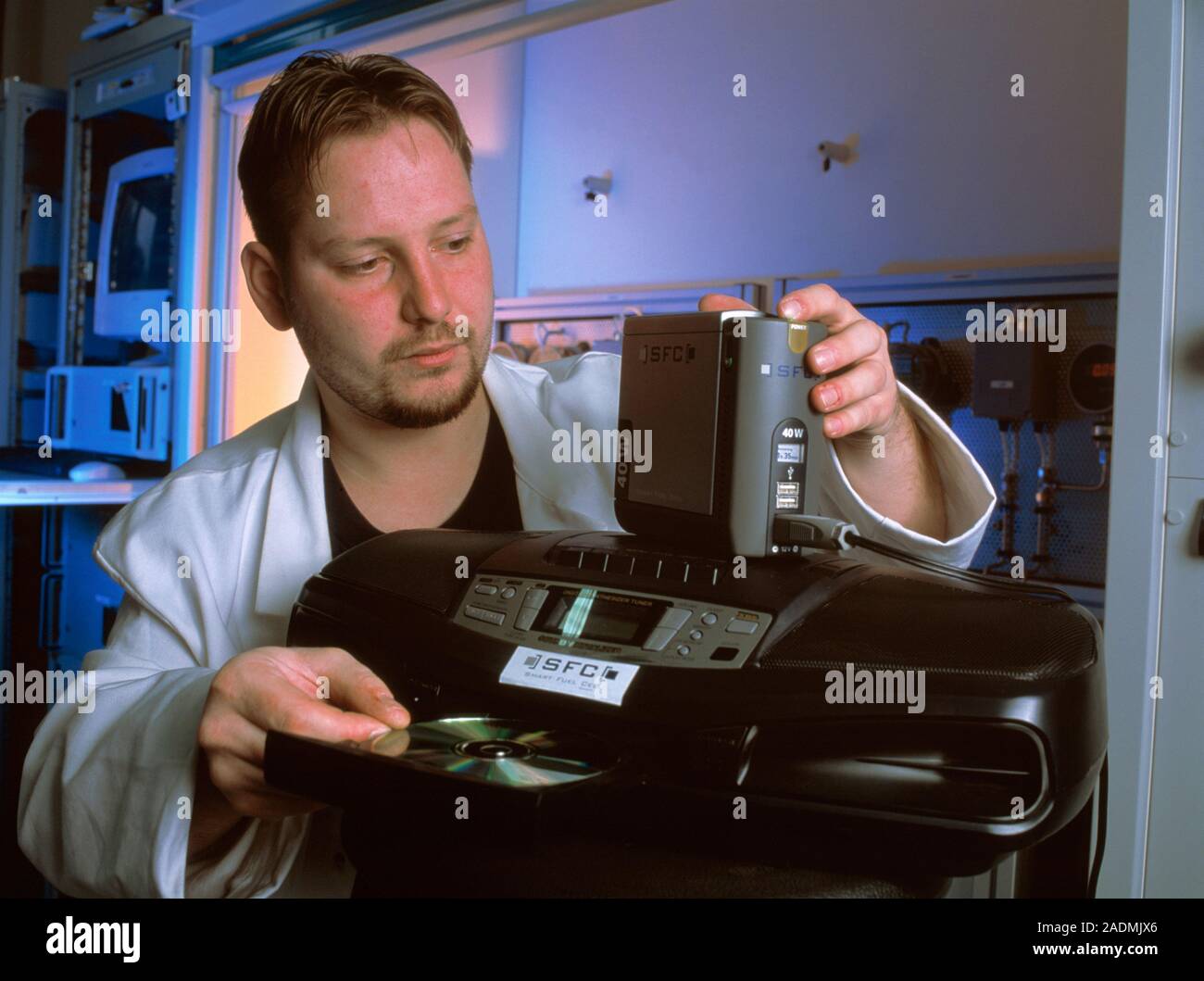 Fuel cell. Researcher using a direct methanol fuel cell (DMFC) to power ...