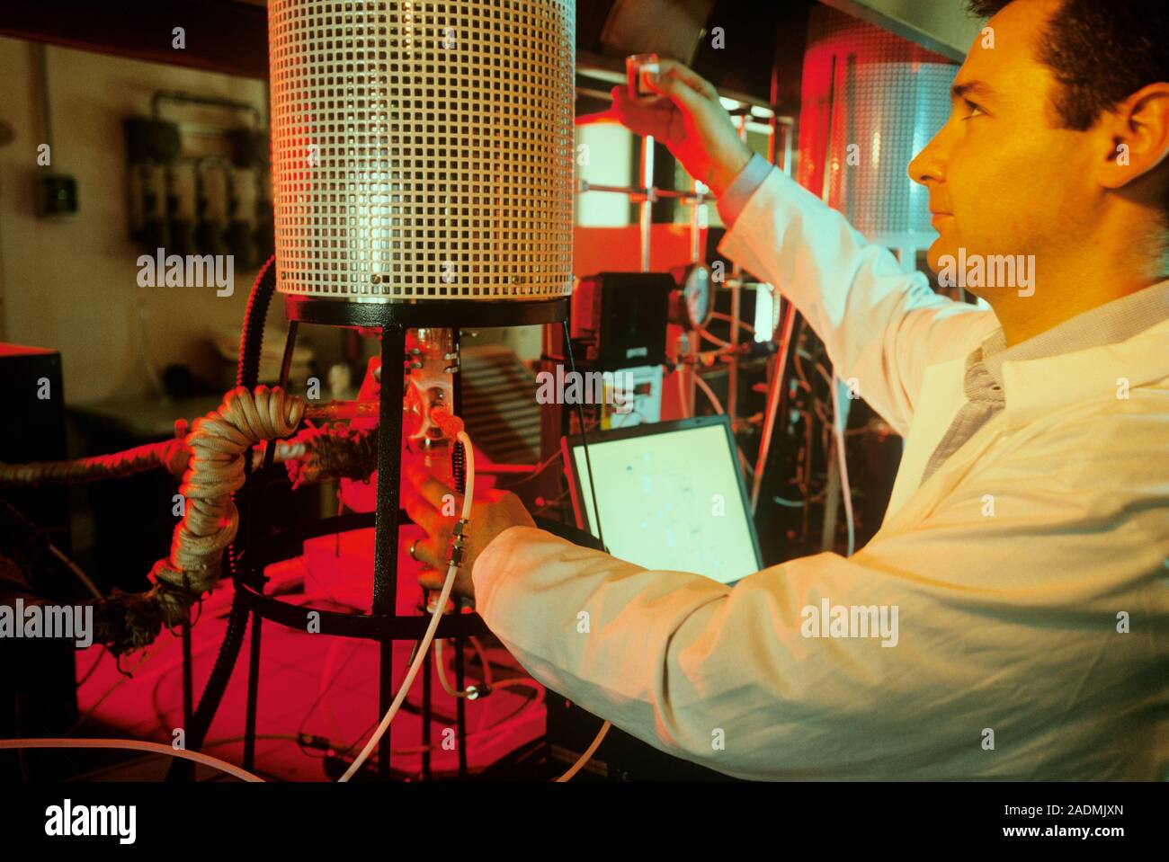 Fuel cell research. Researcher studying methods of producing hydrogen ...