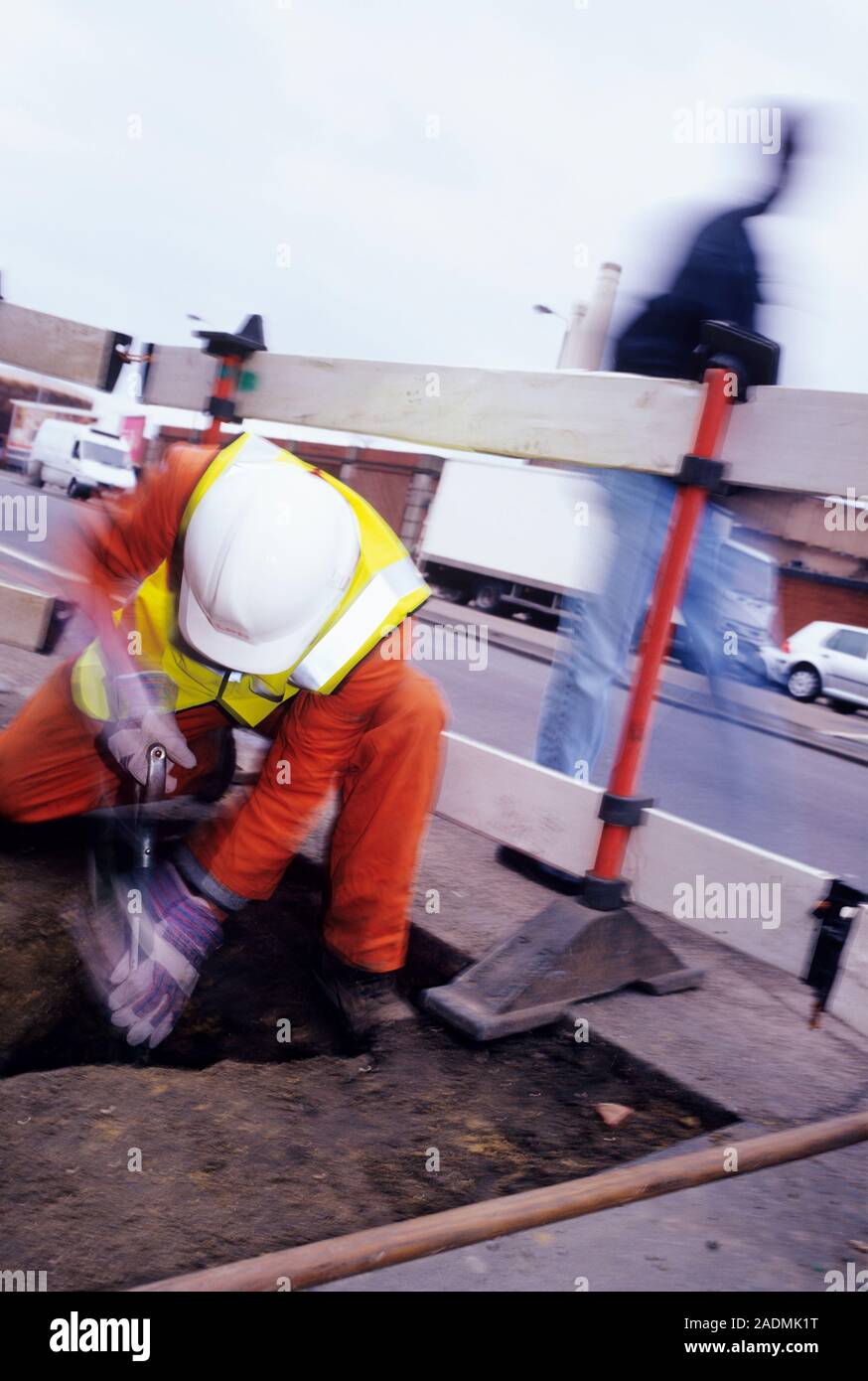 Repairing gas pipeline. Worker digging a hole to allow access to an ...