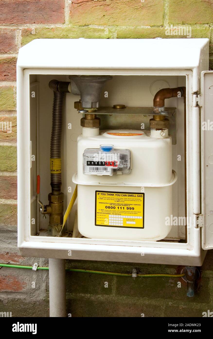 Domestic gas meter connected to a gas pipe (lower left). The meter is ...