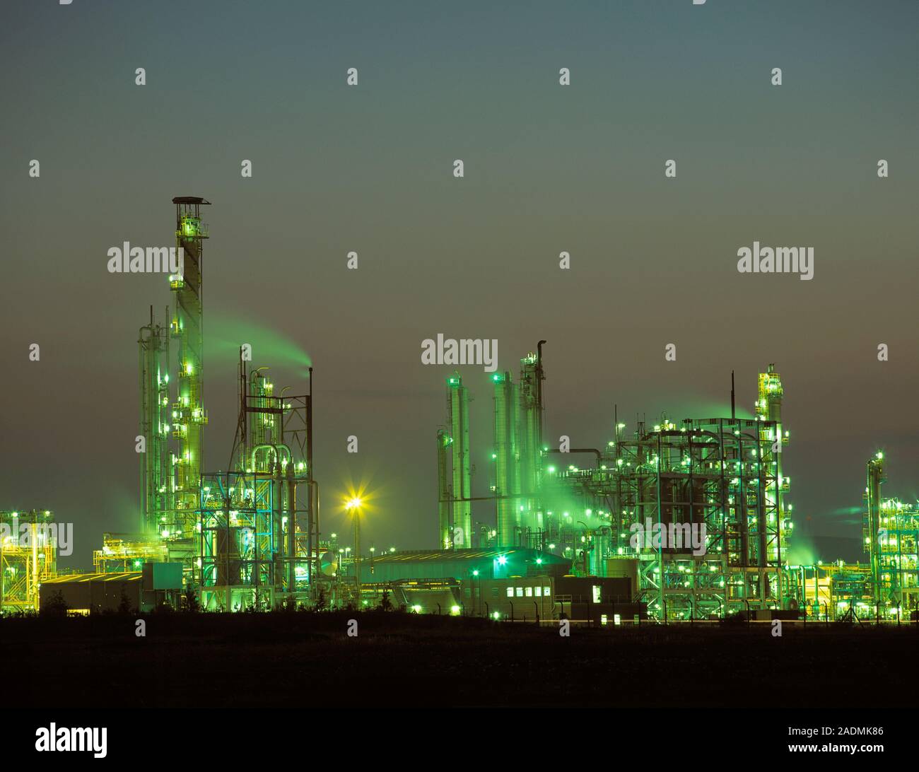Oil refinery. Night-time view of an oil refinery. In the refinery ...
