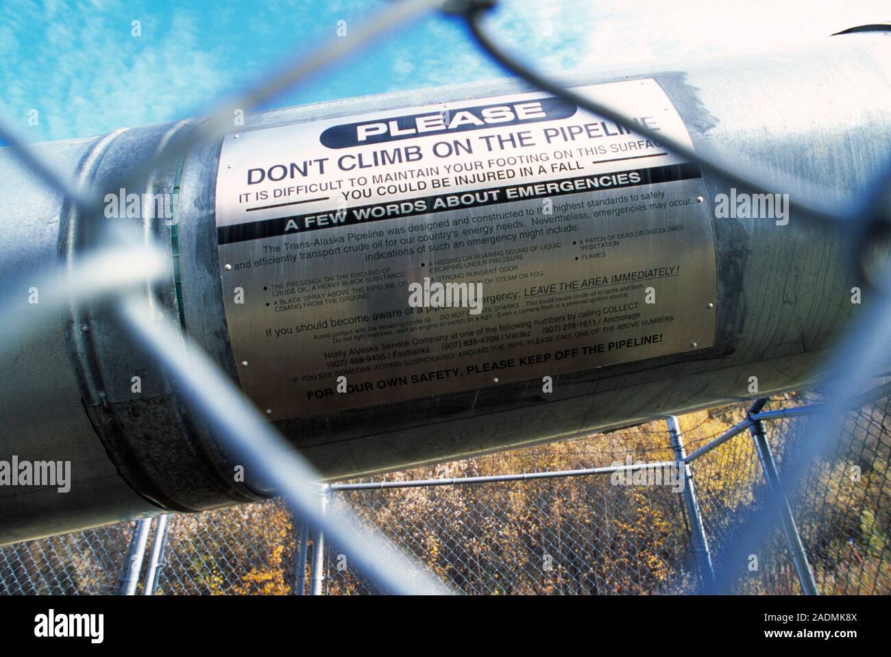Trans-Alaska oil pipeline warning sign. This pipeline transports crude ...