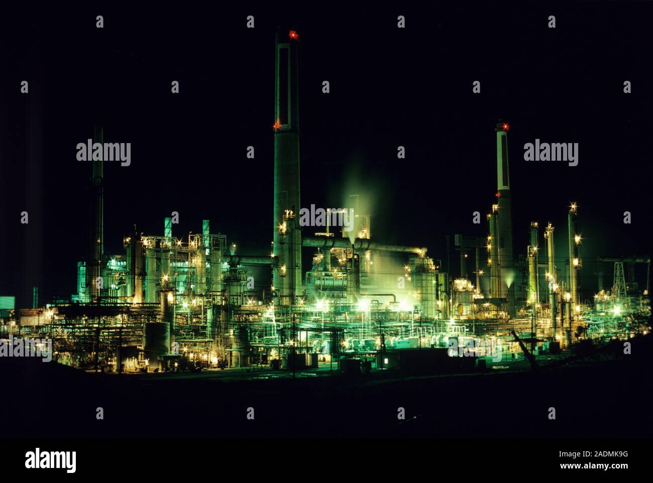 Oil refinery lit up at night. Photographed in the San Francisco Bay ...