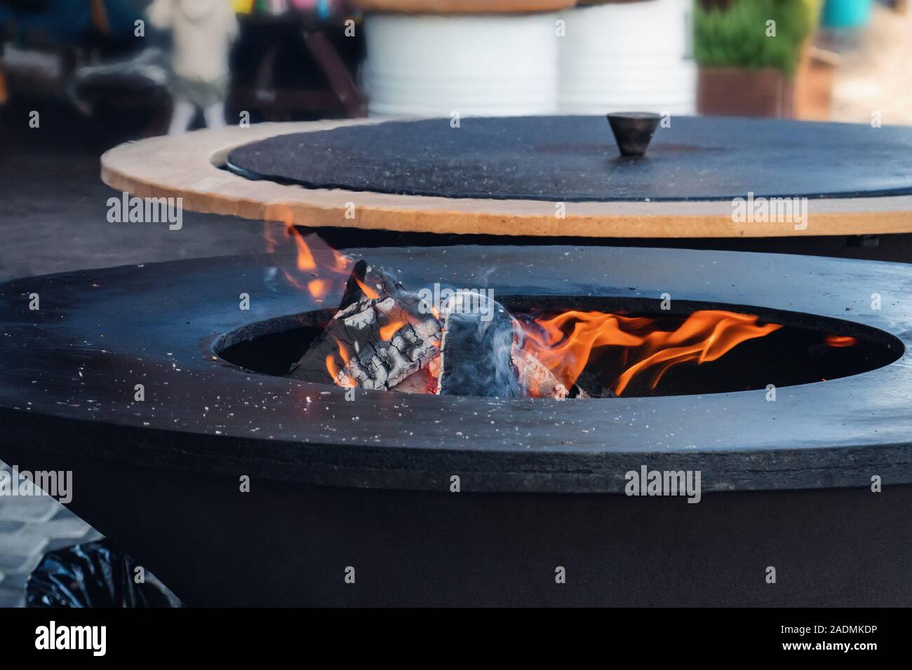 Outdoor wood-burning grill for frying steaks and pork ribs over an open ...
