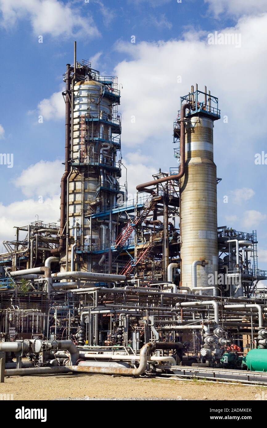 Oil refinery. Atmospheric pipestill (right) and a vacuum pipestill ...