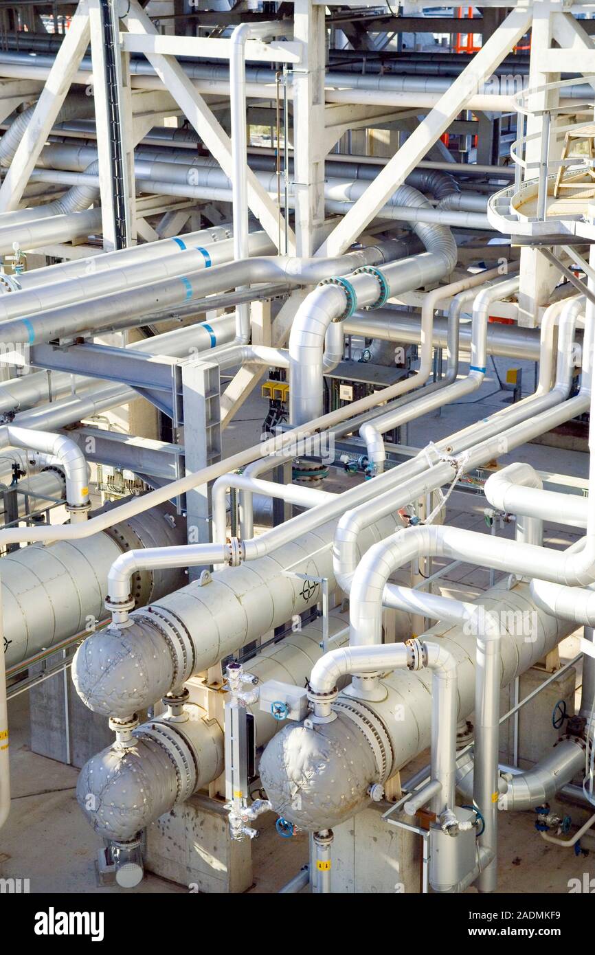 Oil refinery pipes in the hydrofining area. This is where crude oil ...