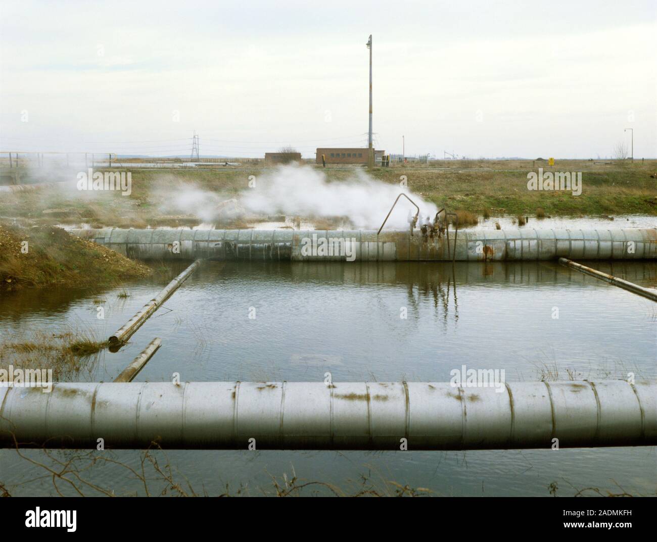 Disused oil refinery. Pipelines at a former oil refinery. This oil ...