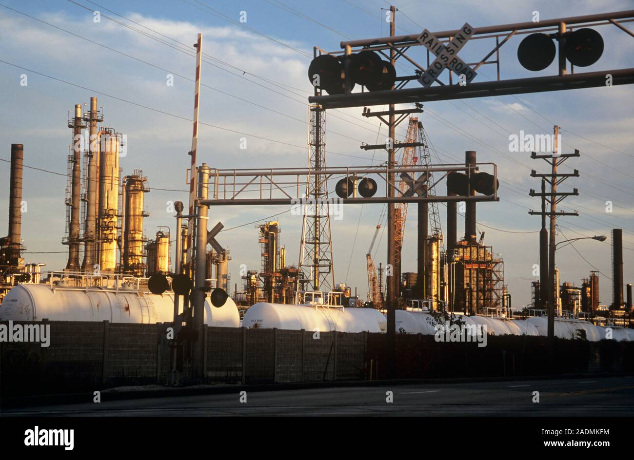 Oil refinery. Tankers outside an oil refinery. Crude oil is a mixture ...