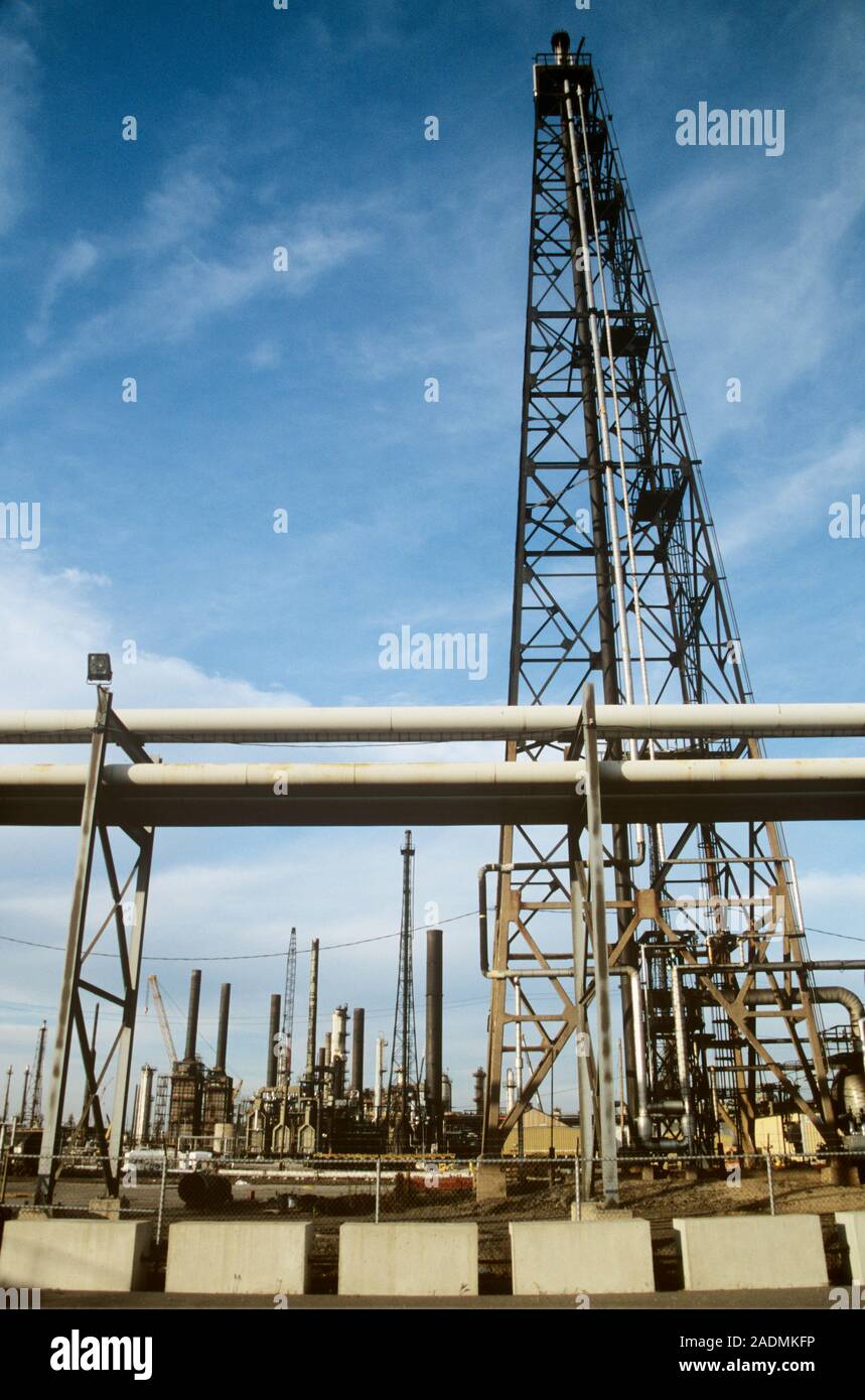 Oil refinery. Flare tower in an oil refinery. Flare towers are a way of ...