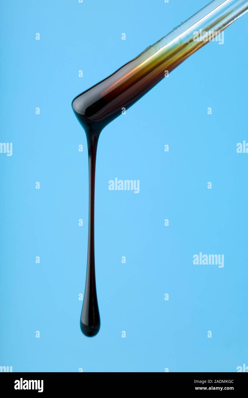 Crude oil. Image 2 of 2. Crude oil dripping from a glass rod. This ...