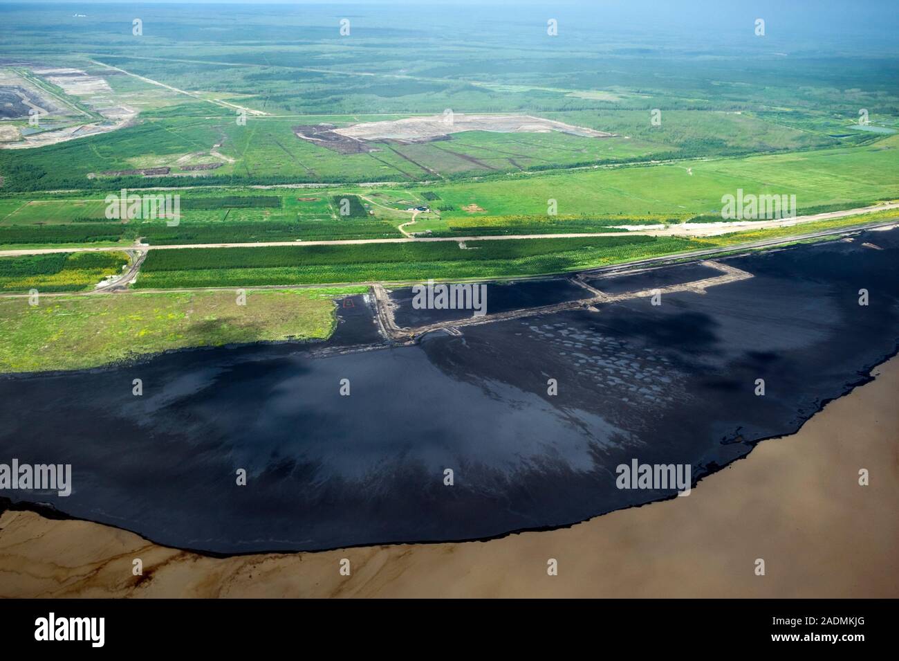 Oil plant settling pond, aerial photograph. The waste water in this ...