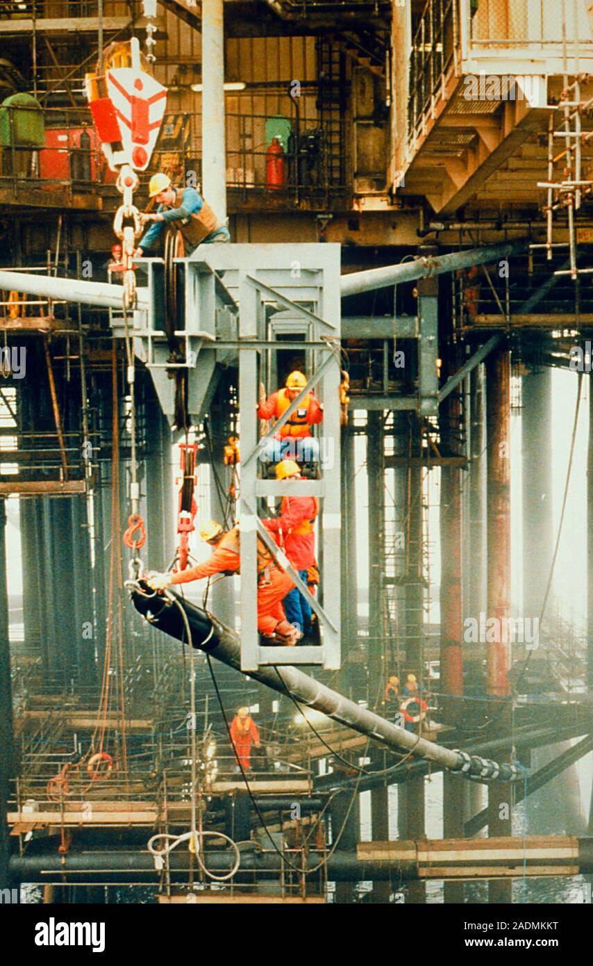 Engineers installing a riser section on the BP Forties Charlie oil ...