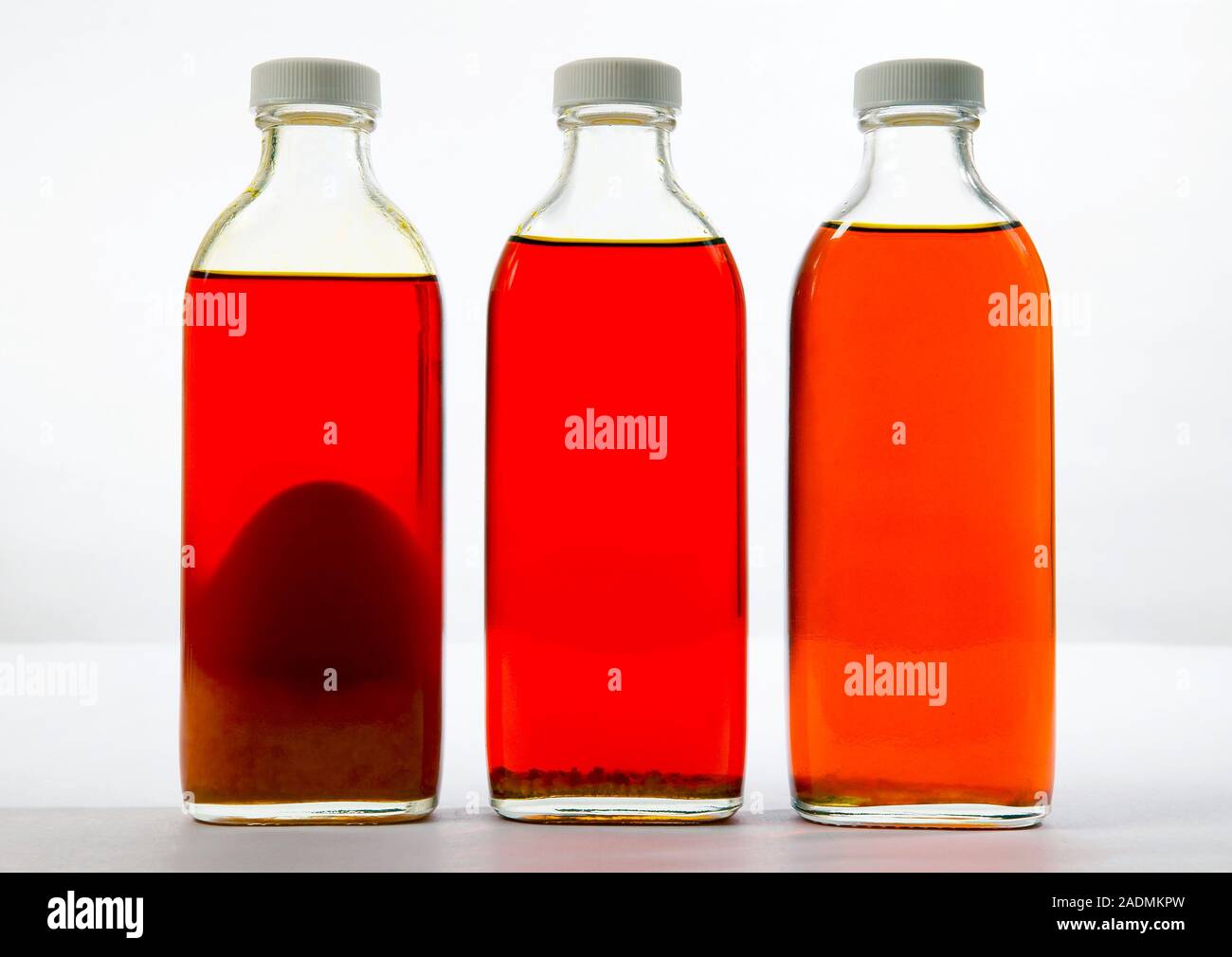 Biofuel research. Bottles of various products in the stages used to ...