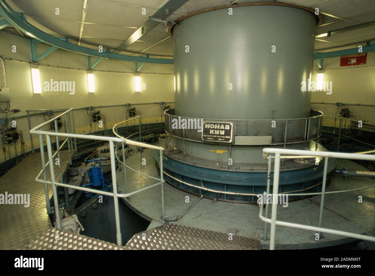 Hydroelectric generator. Generator shaft (large cylindrical structure ...