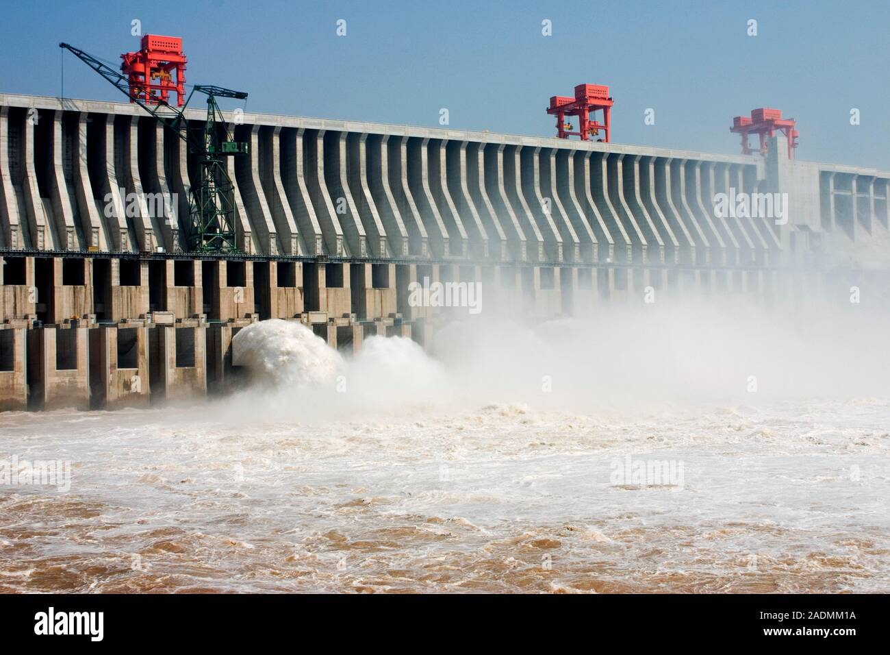 Three Gorges Dam, with water emerging from the spillway. The dam is 2.4 ...