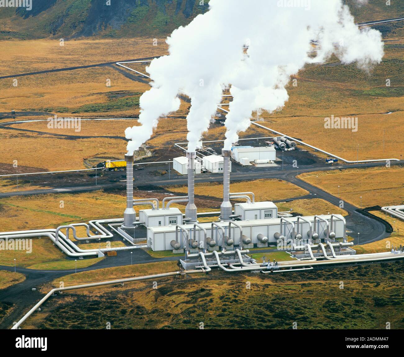 Geothermal power station. Steaming chimneys at a steam separation plant ...