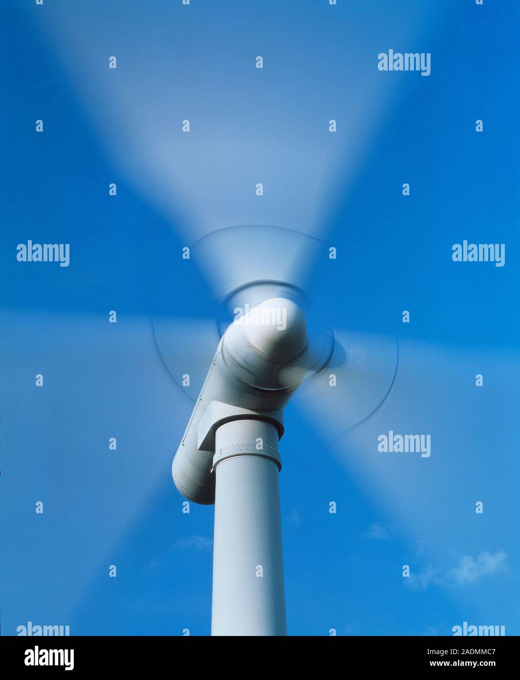 Wind turbine. Spinning blades of a 600kW wind turbine. As the blades ...