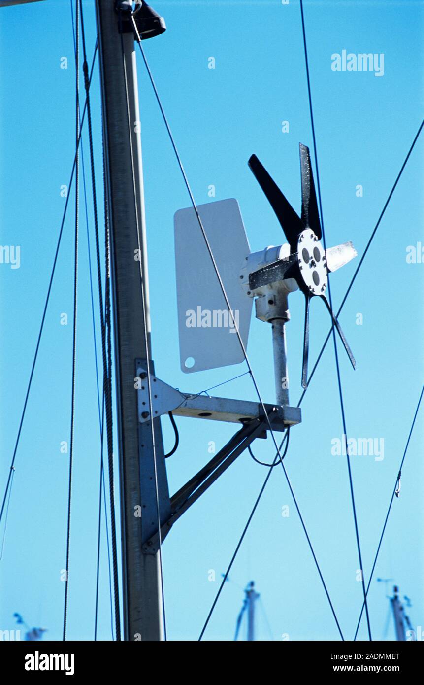 Wind turbine on a boat. The wind catches the blades of the turbine ...