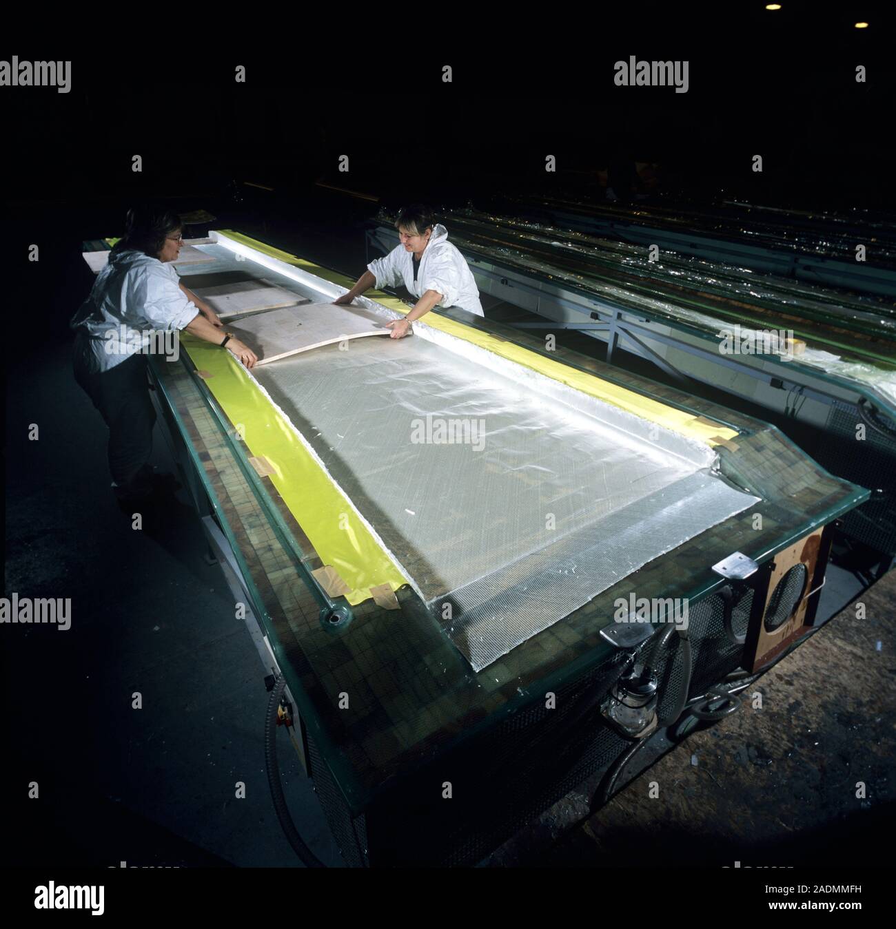 Wind turbine material production. Workers producing composite materials ...