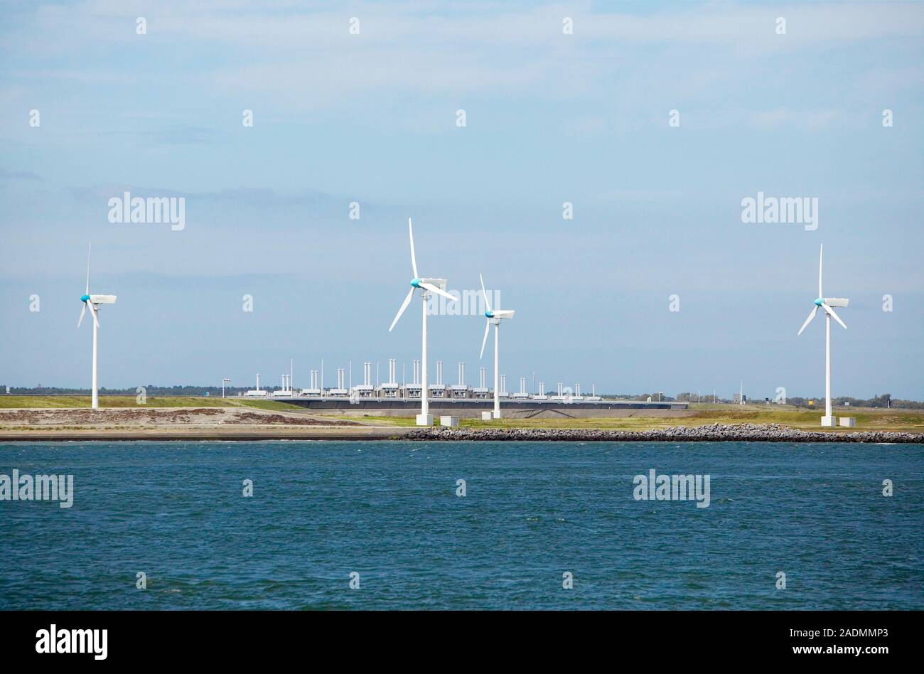 Wind turbines at Neeltje-Jans Windpark, near a Deltaworks flood barrier ...