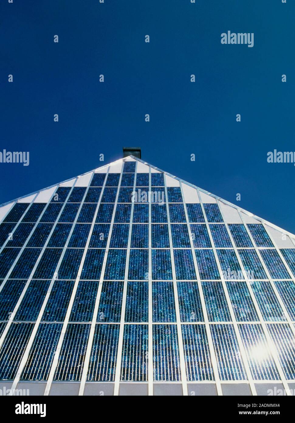 Solar panels. Array of photovoltaic cells (solar panels) on a roof. The ...