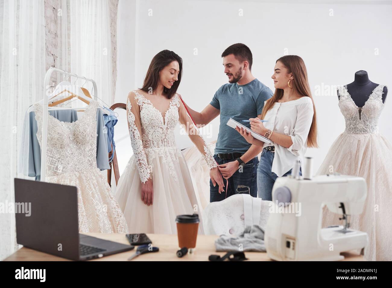 Sleeves is perfect. The process of fitting the dress in the studio of ...