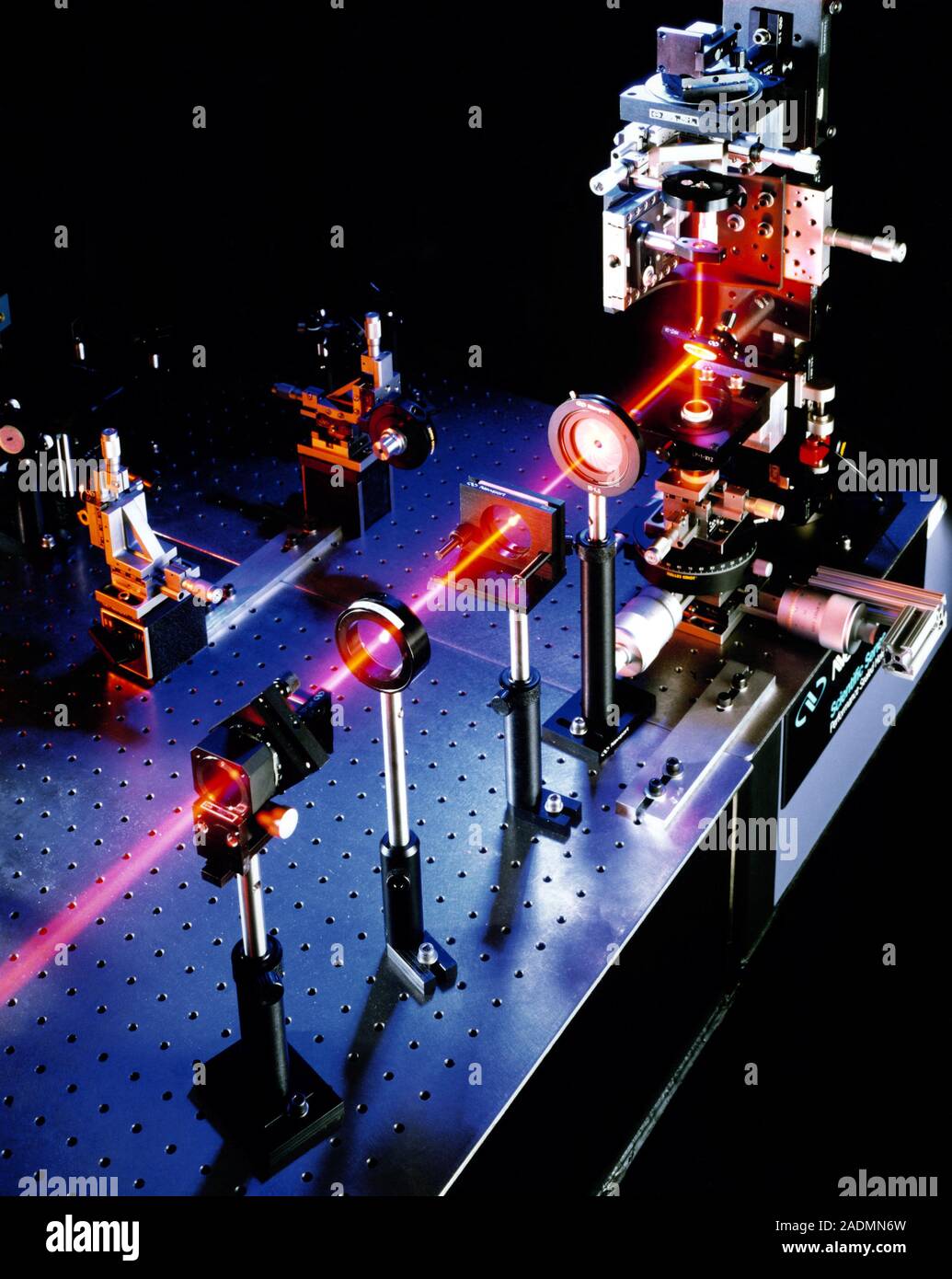 Laser for solar cell research. Spectroscopic laser (red beam) being ...