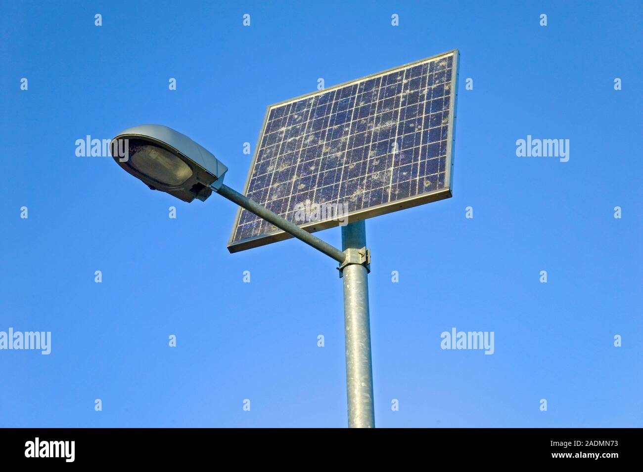 Solar powered streetlight. The lamp battery charges in the day, storing ...