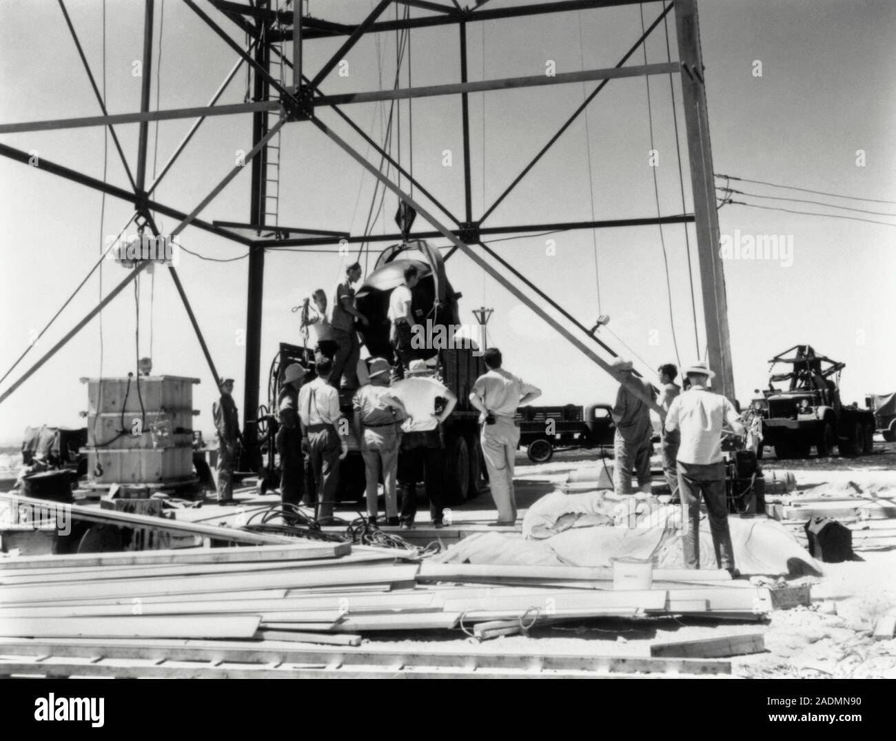 The Trinity device, the world's first atom bomb, being raised onto its ...