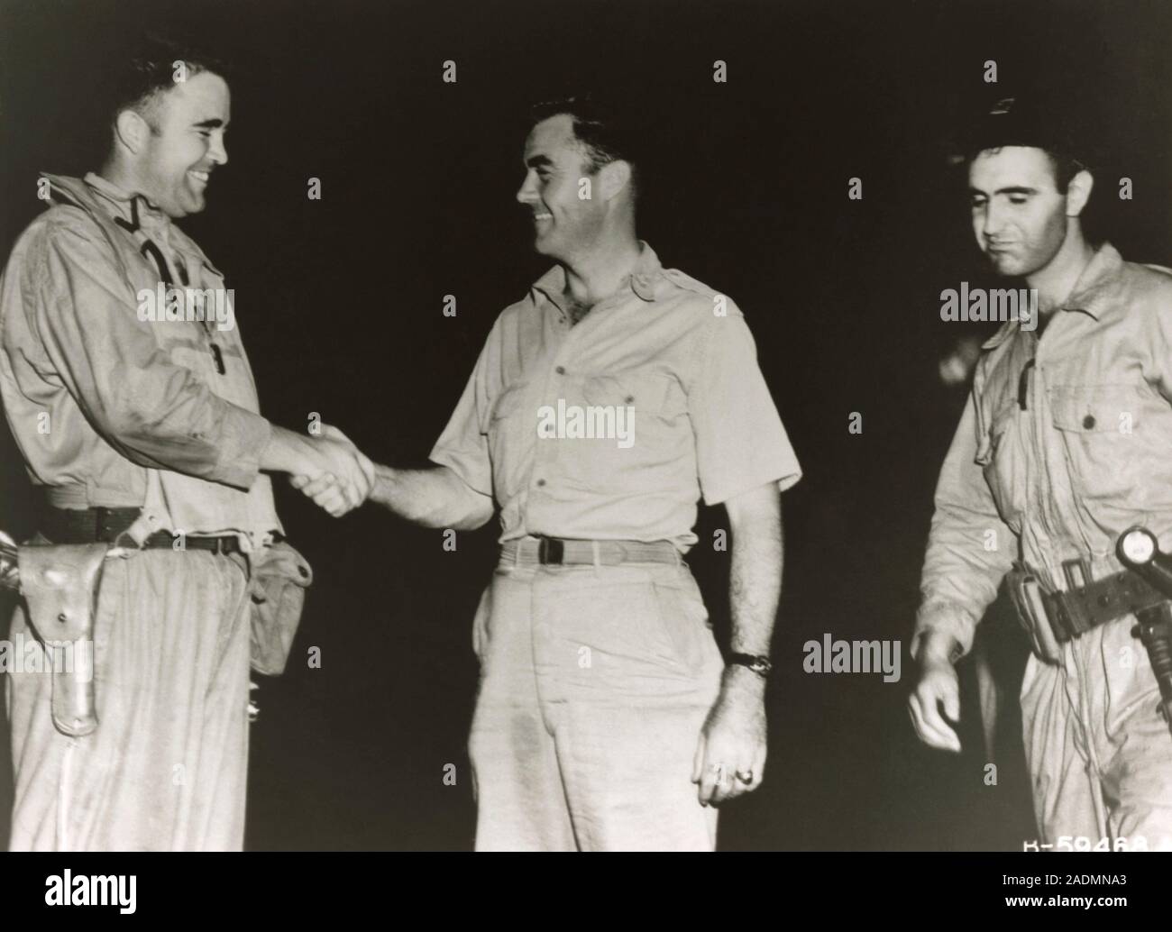 Pilots of the two atomic bomb missions. Colonel Paul Tibbets (centre ...