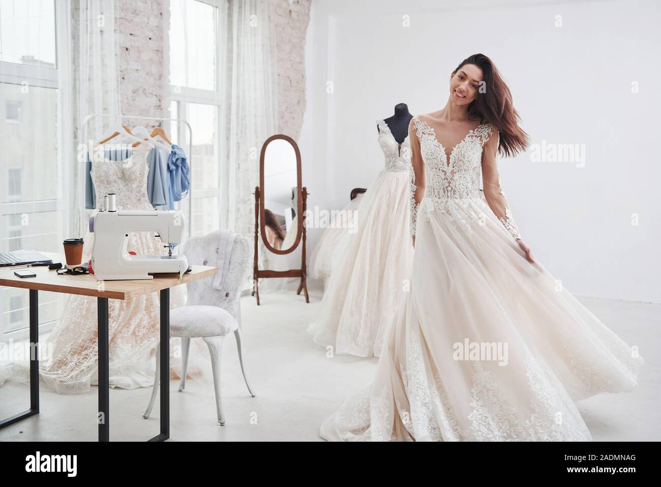 Bride is ready for her wedding. The process of fitting the dress in the ...