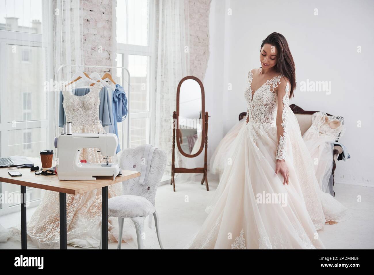 Everything looks perfect. The process of fitting the dress in the ...