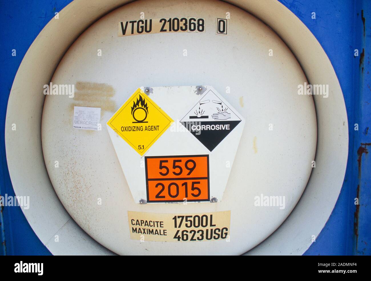 Hazardous chemical. Warning sign on a chemical drum containing hydrogen ...