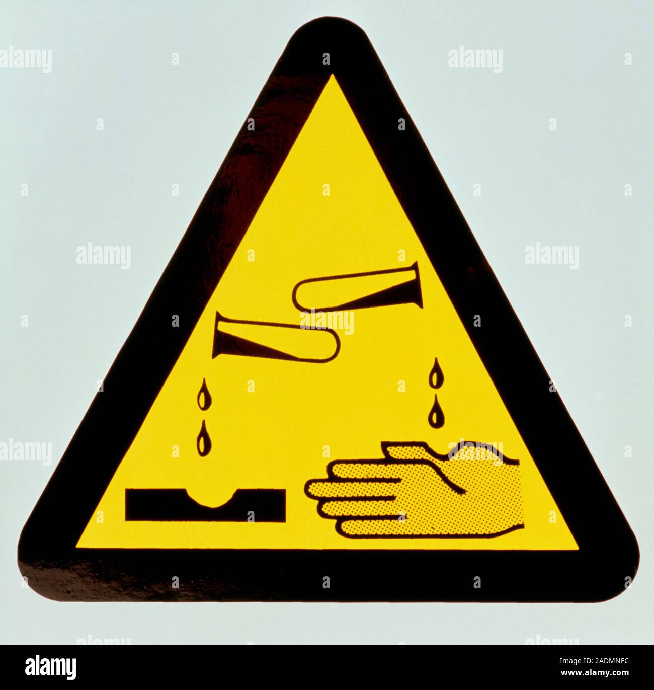 Corrosive chemical sign. Sign warning of the presence of corrosive ...
