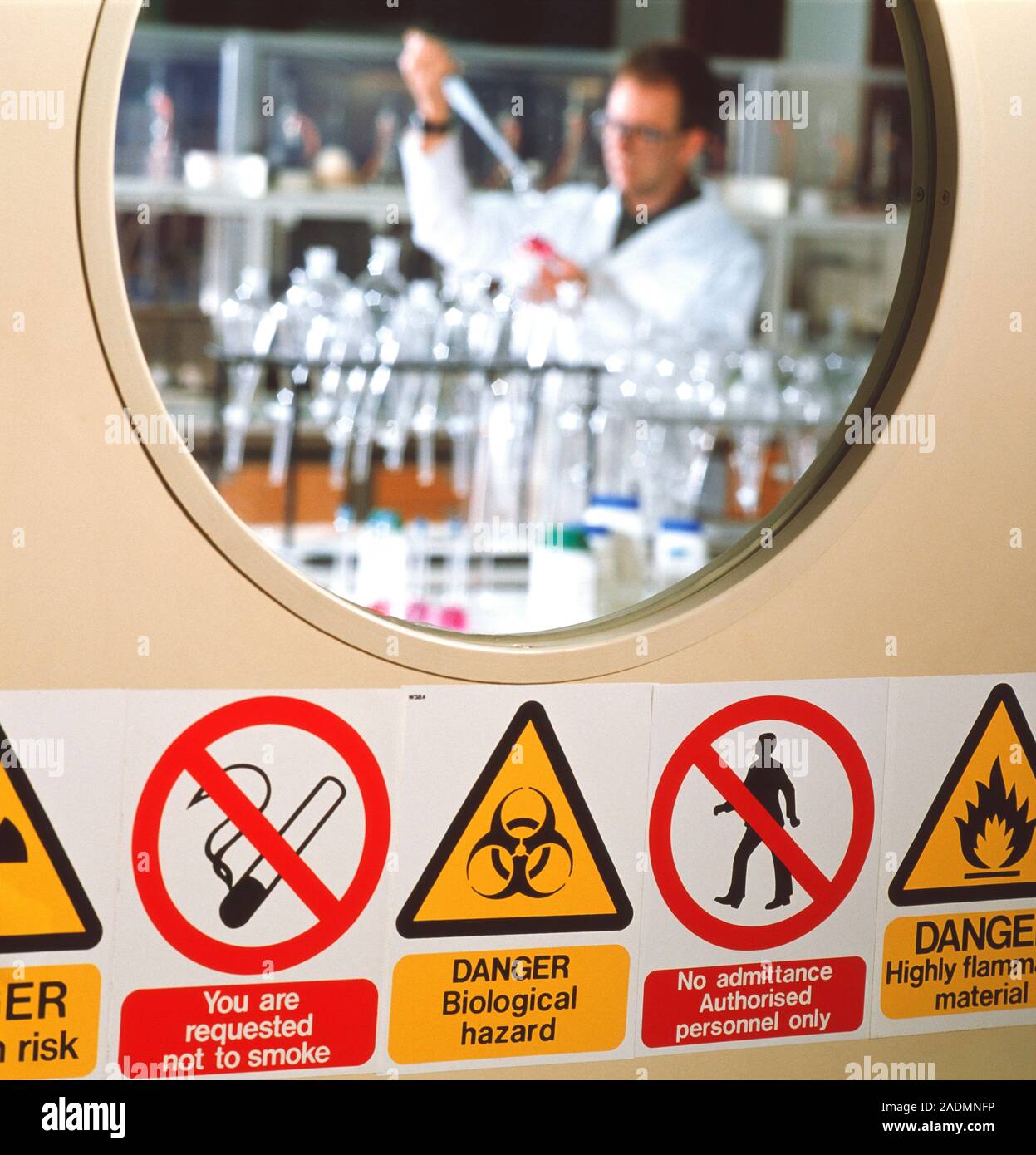 Laboratory safety signs. Safety signs seen on the door of a laboratory ...