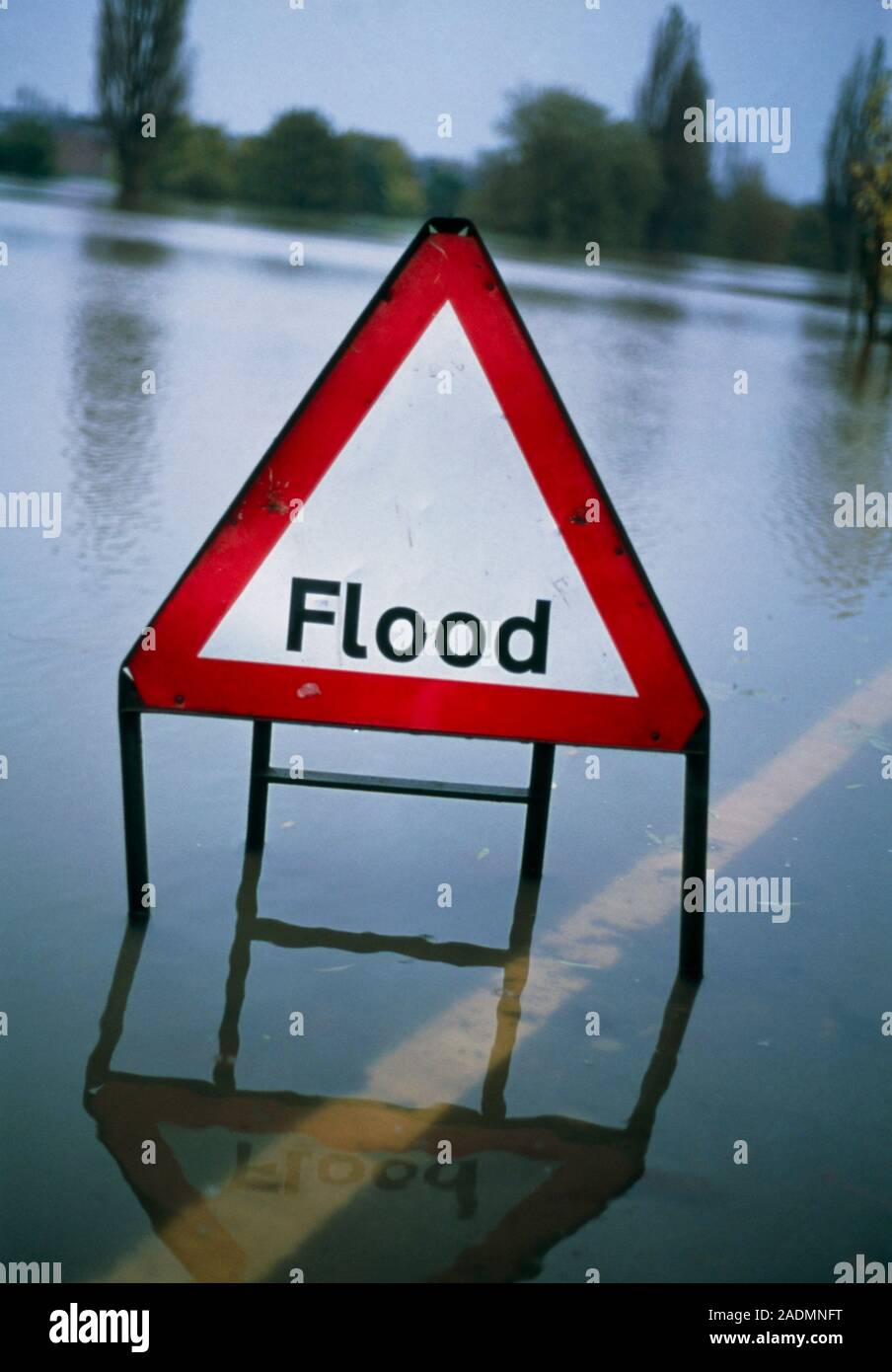 Flood hazard sign on a submerged road. Prolonged heavy rainfall was the ...