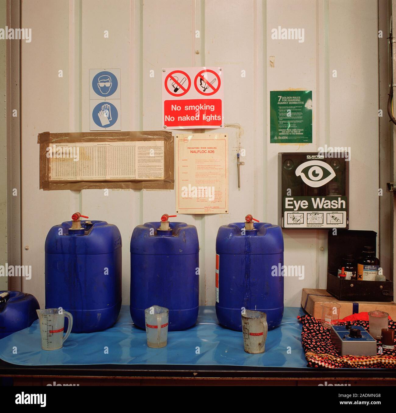 Chemical safety signs and information by barrels of a chemical. The ...