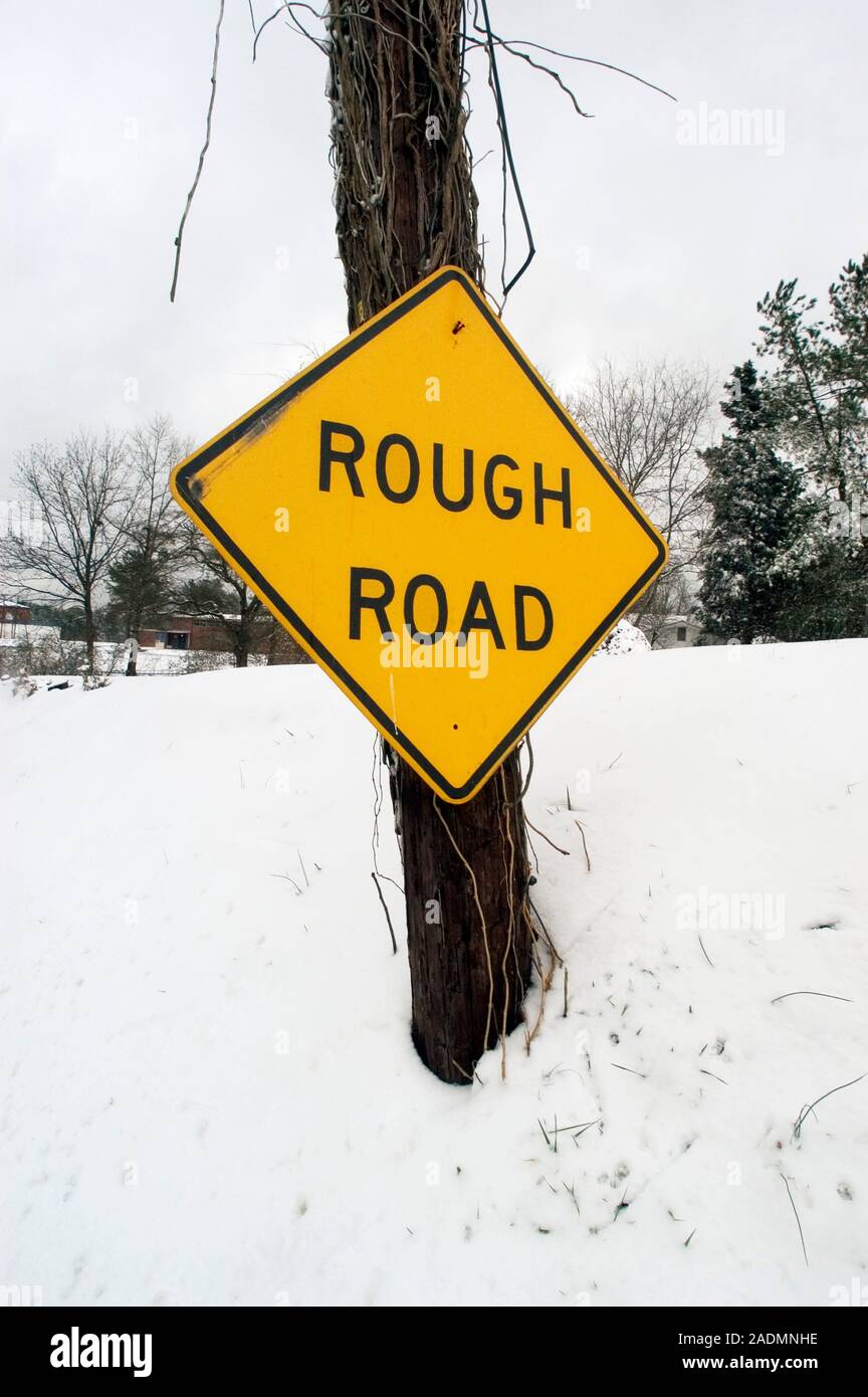 Road sign. Rough road" sign buried in a snow drift Stock Photo - Alamy