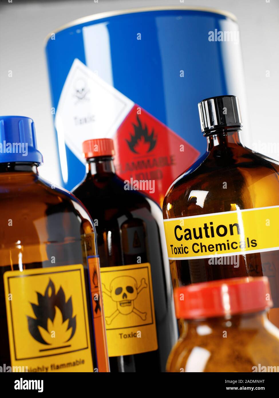 Hazardous chemicals. Containers labelled with chemical hazard warning ...