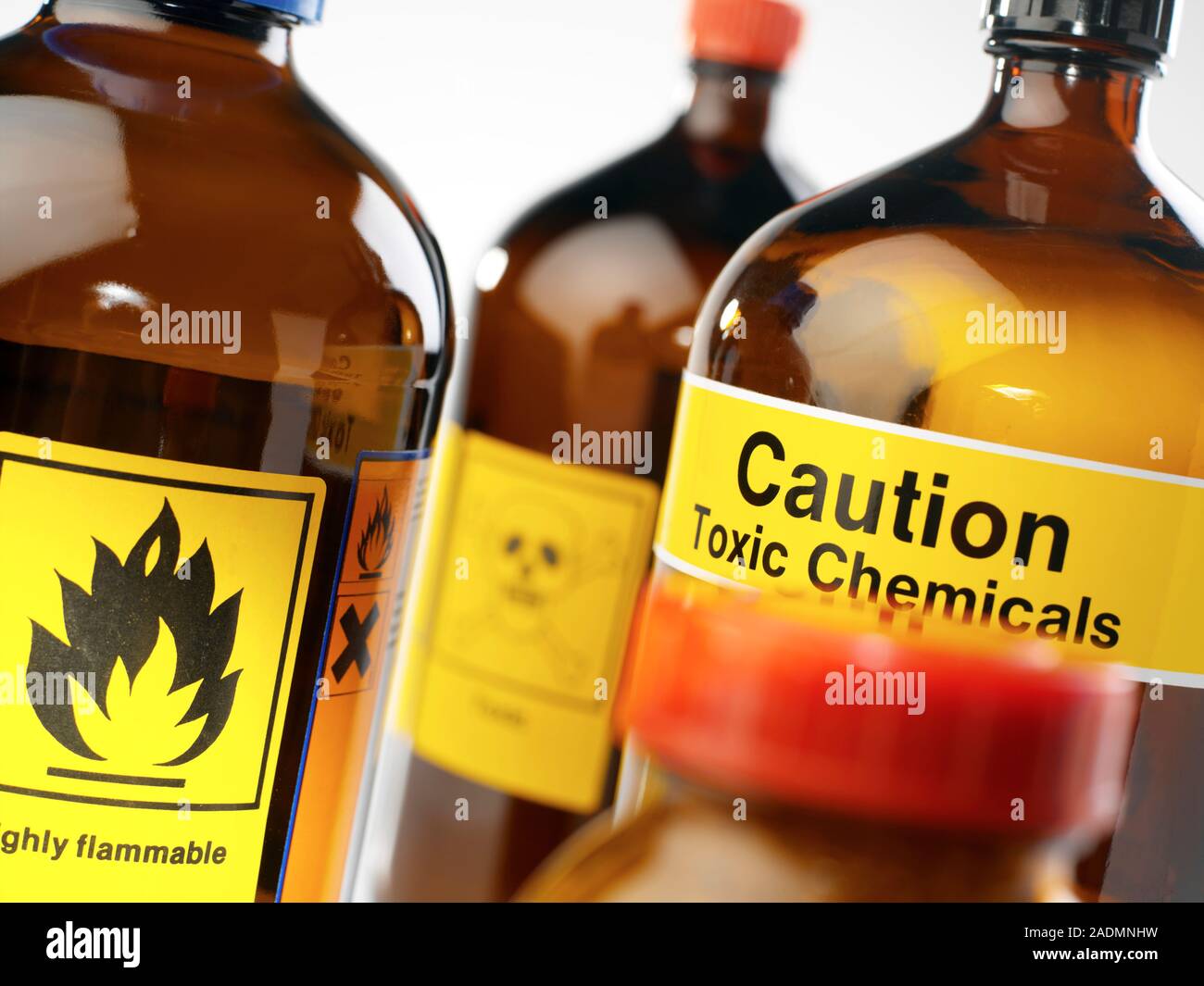Hazardous chemicals. Containers labelled with chemical hazard warning ...