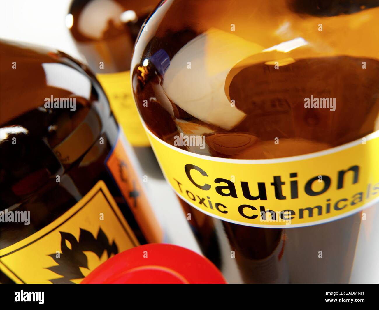 Hazardous chemicals. Containers labelled with chemical hazard warning ...