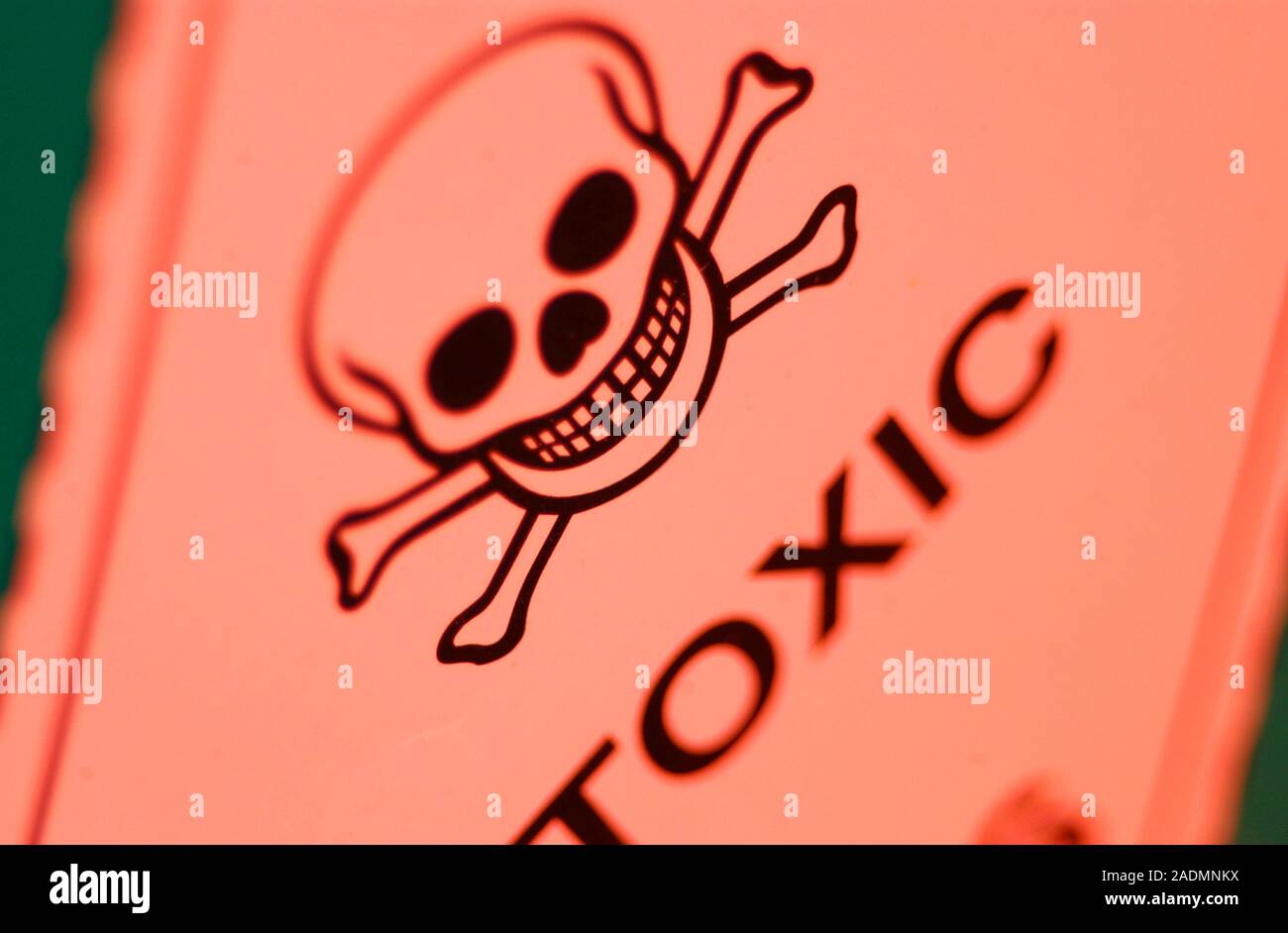 Toxic warning sign on hazardous material Stock Photo - Alamy