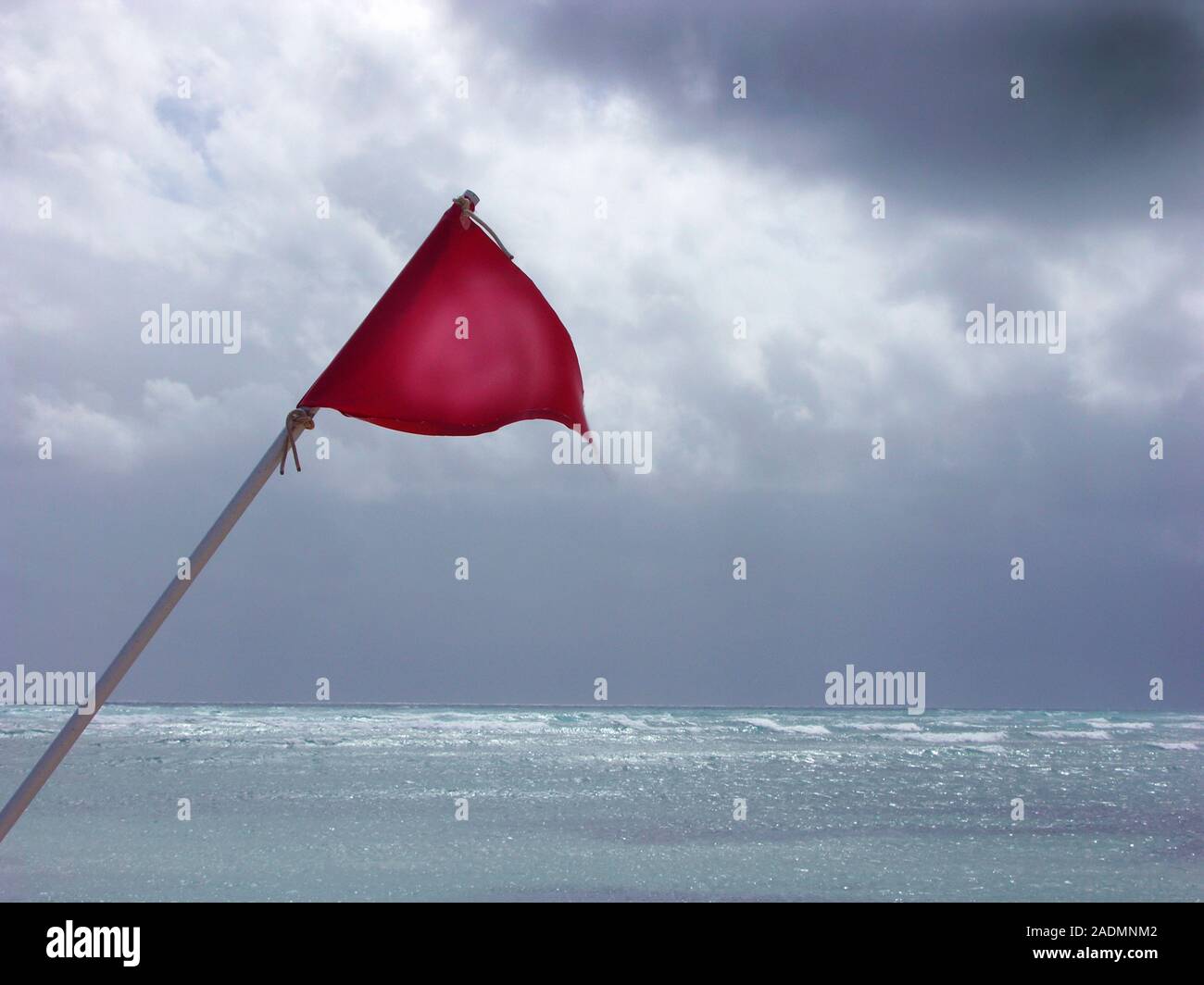 Red flag at a beach. This indicates that swimming is prohibited ...