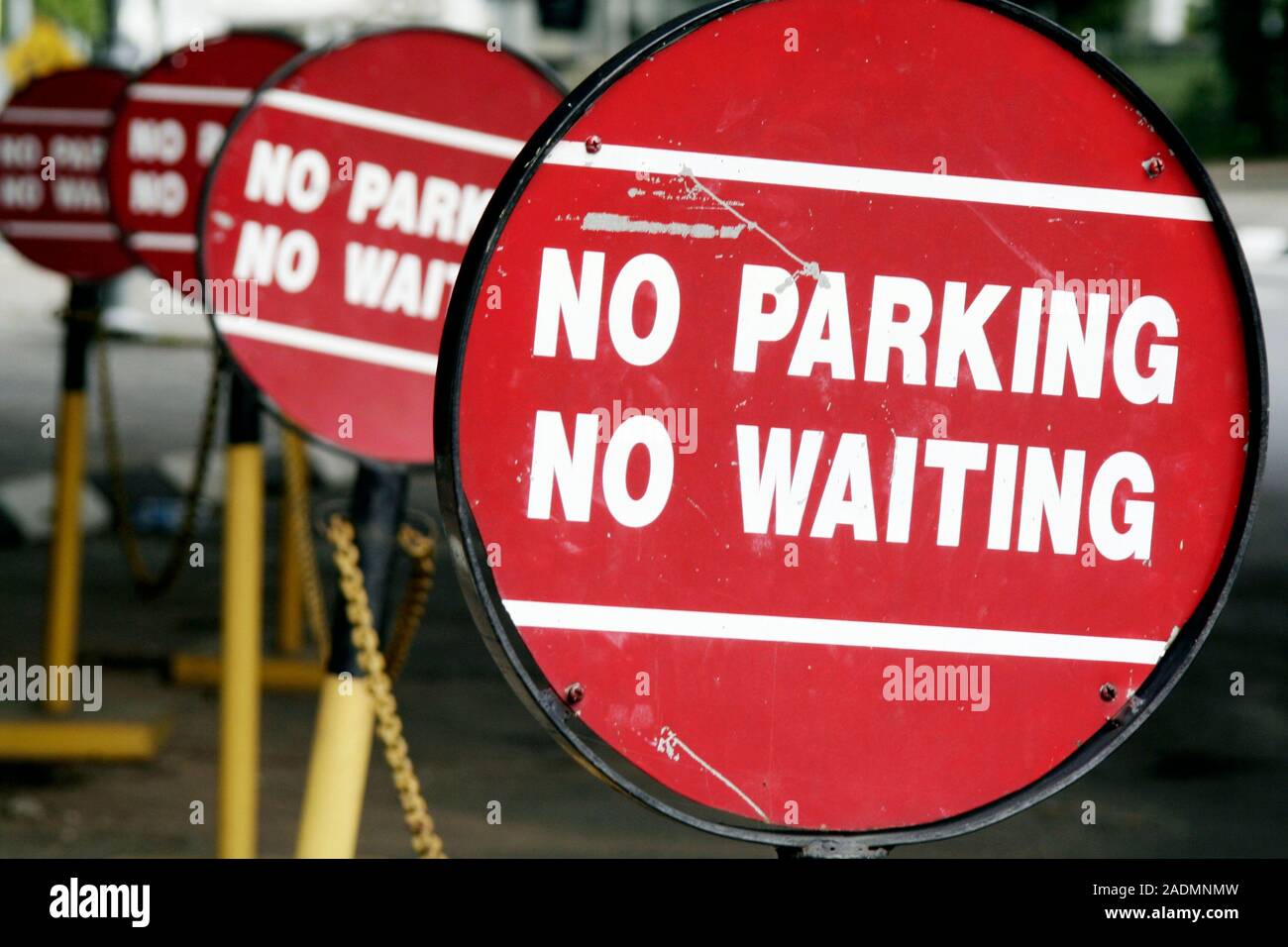 Road signs warning drivers not to stop Stock Photo - Alamy